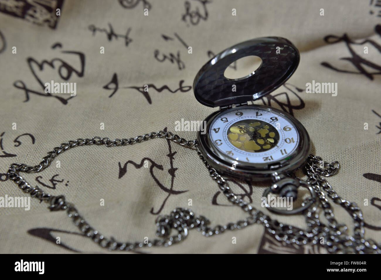 Pocket watch book stack hi-res stock photography and images - Alamy