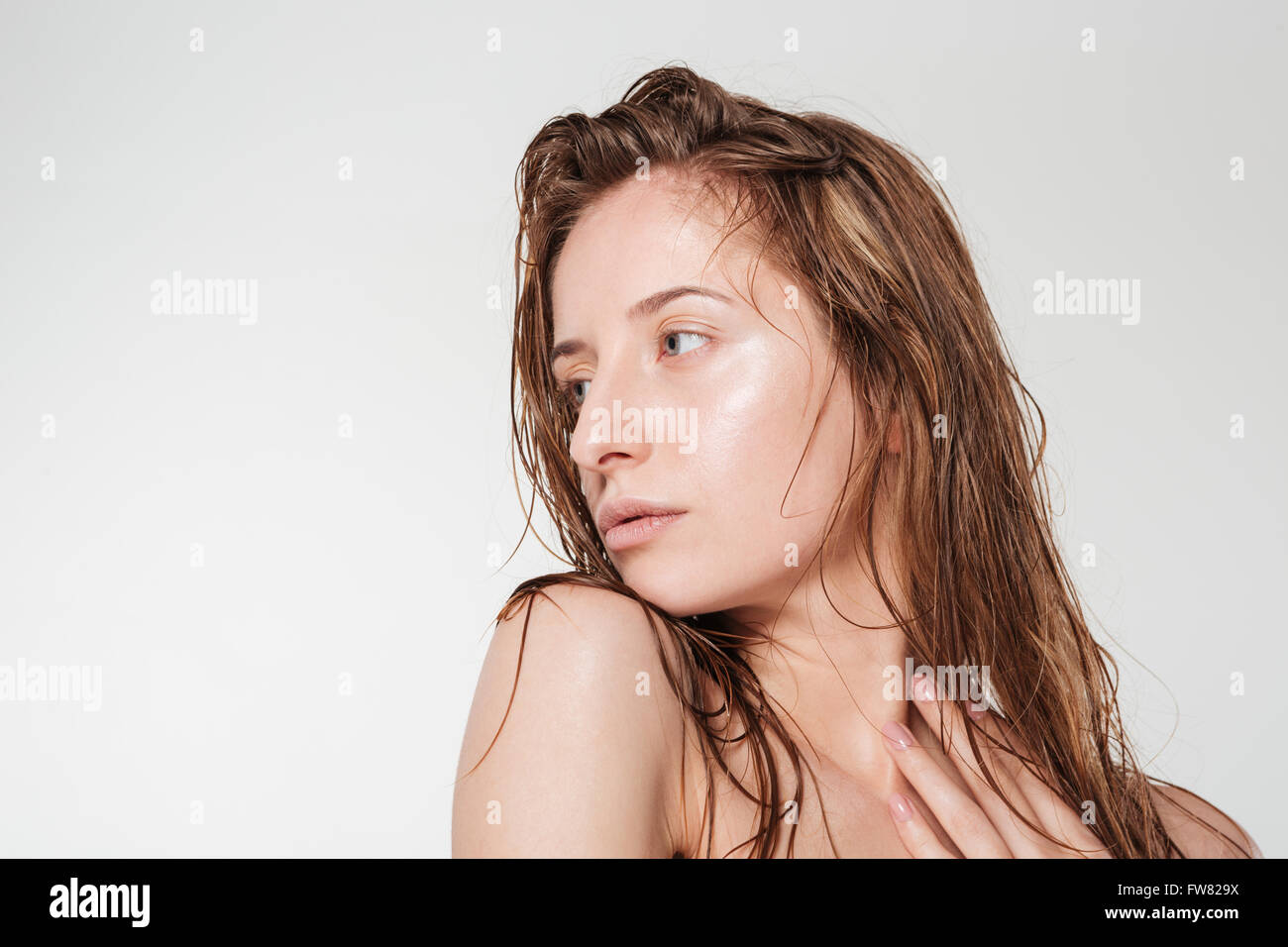 Beauty portrait of a pretty woman with fresh skin looking away isolated ...