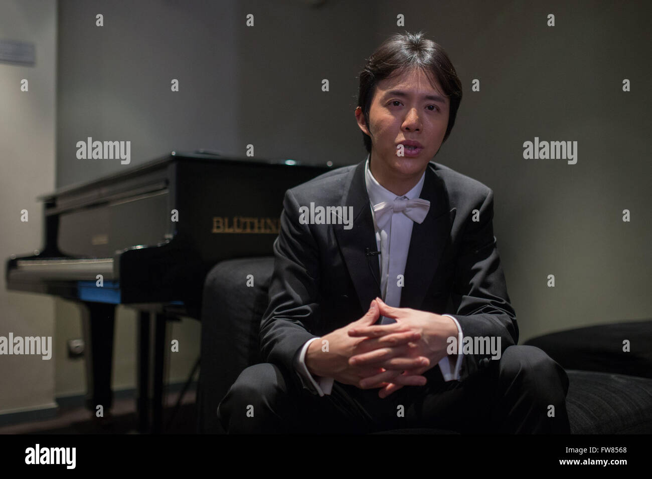 Moscow, Russia. 31st Mar, 2016. Pianist Li Yundi speaks to the media ...