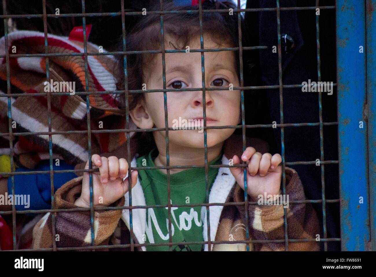 Afghan refugee child at habour of Piraeus. Despite difficult ...