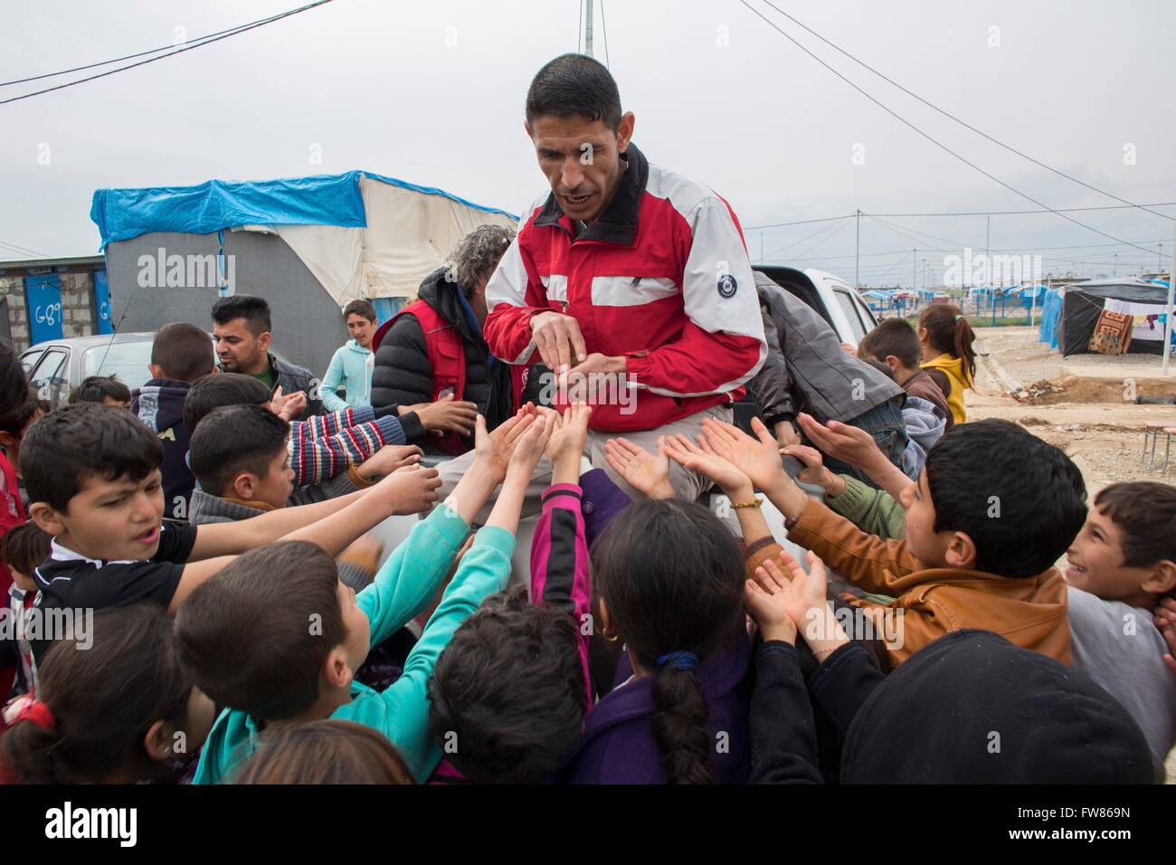sweet distribution by a NGO to refugees in Ashdi refugee camp, Northern ...