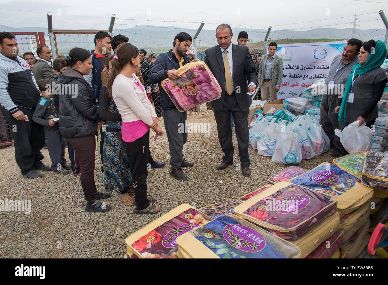 blanket distribution by a Muslim NGO to refugees in Ashdi refugee camp ...