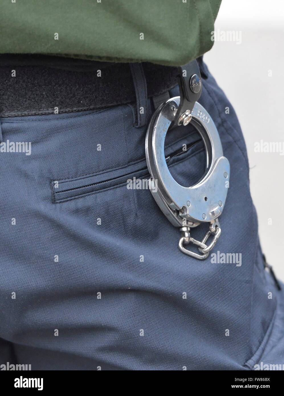 Police officer with handcuffs in Freiburg, March 1, 2016 Stock Photo ...