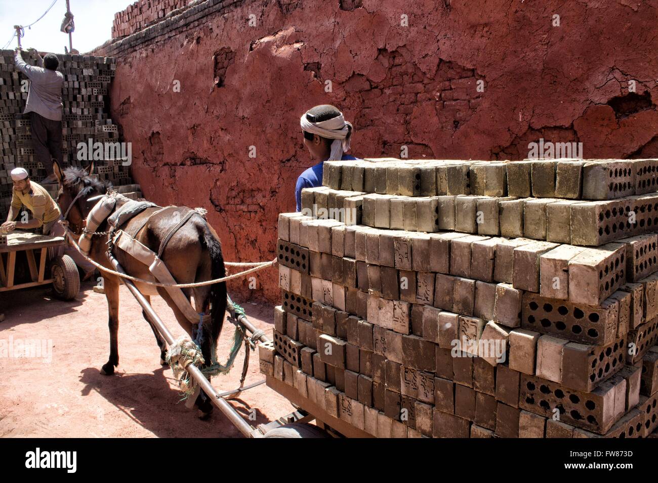 April 1, 2016 - The brick factory workers using carriages pulled by ...
