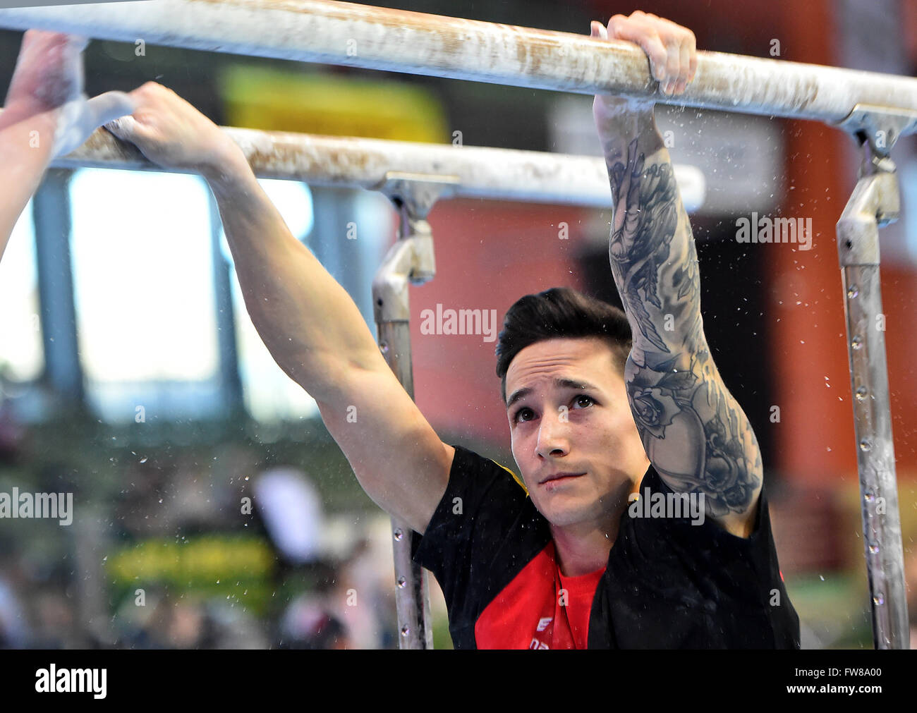 Marcel Nguyen in action at the parallel bars during the qualification ...