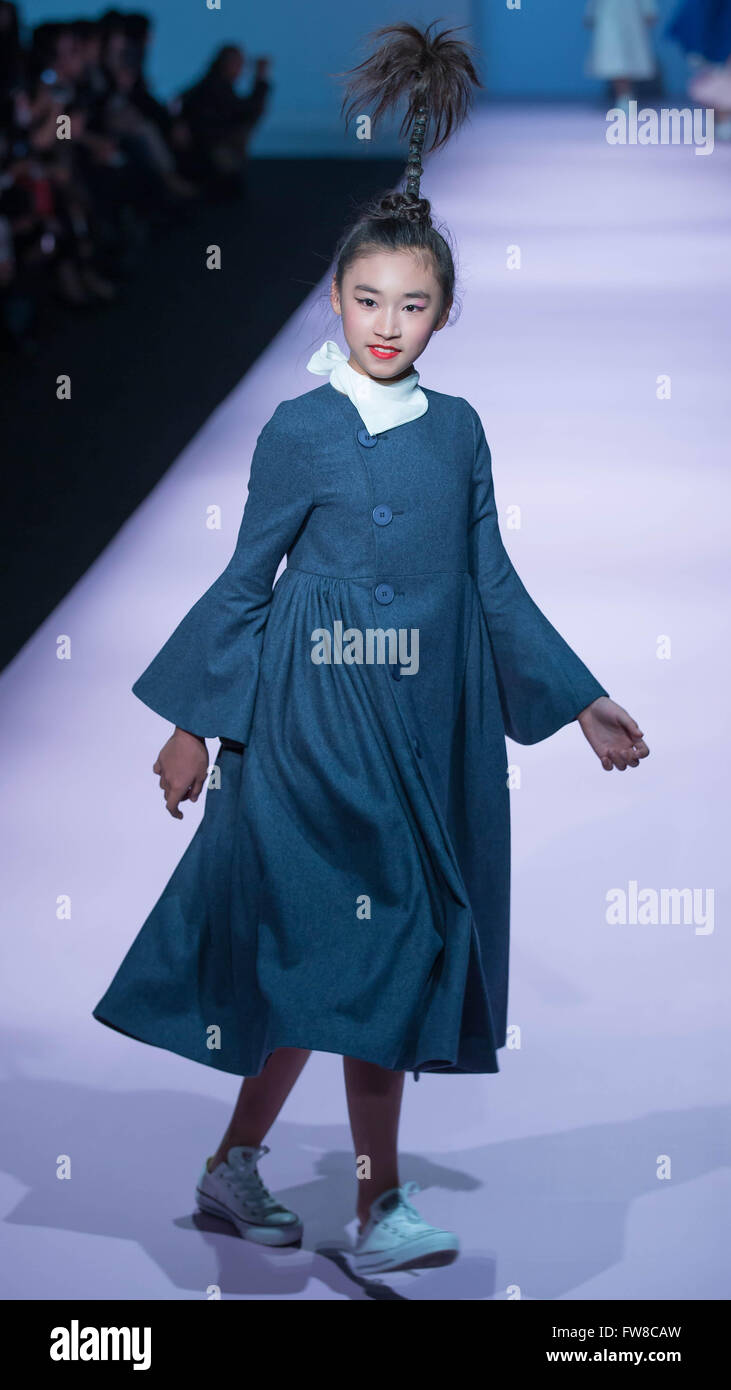 Beijing, China. 31st Mar, 2016. A child presents a creation by designer ...