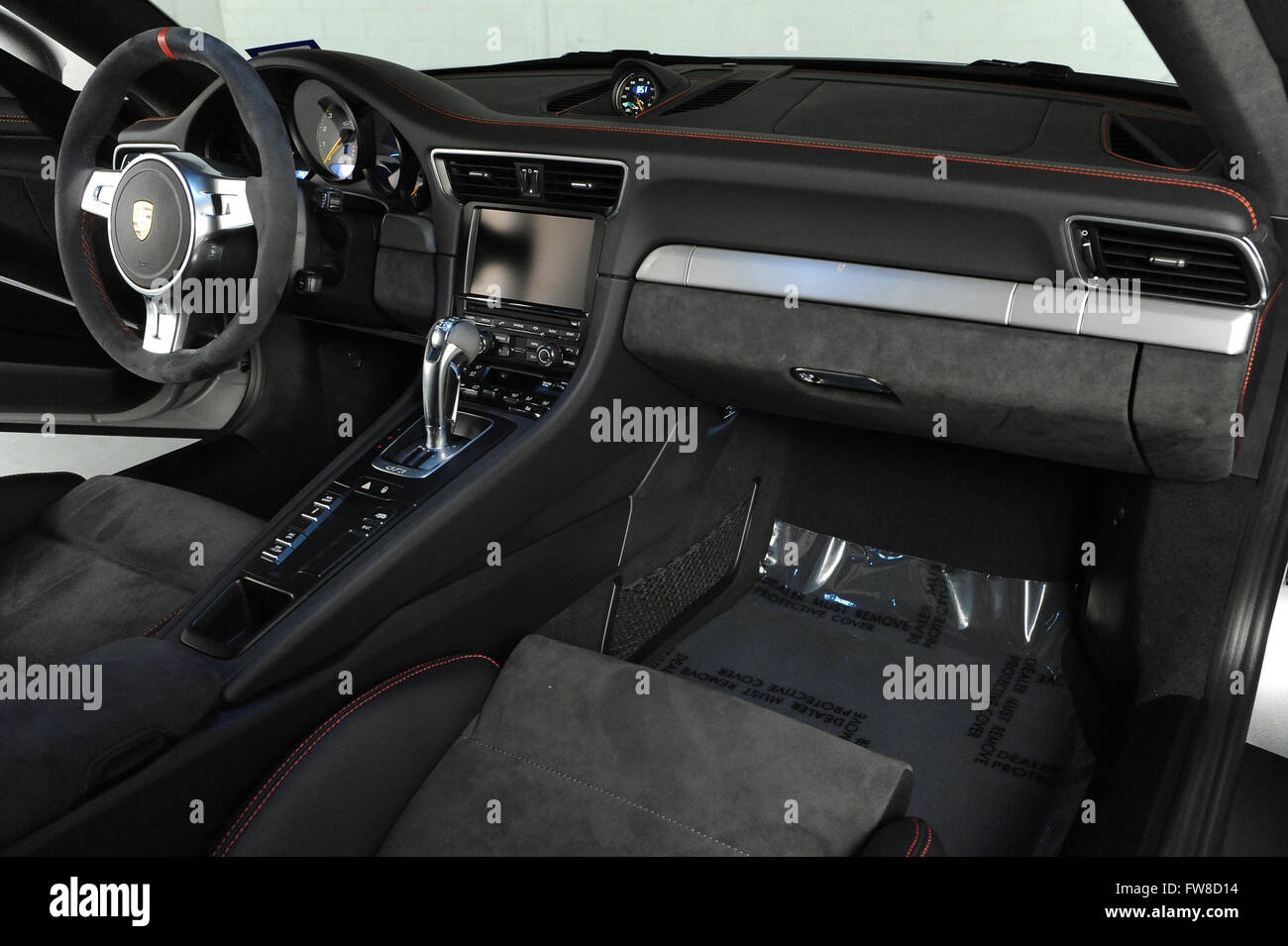 April 1, 2016: A 2015 Porsche GT3 with custom spoiler and leather ...