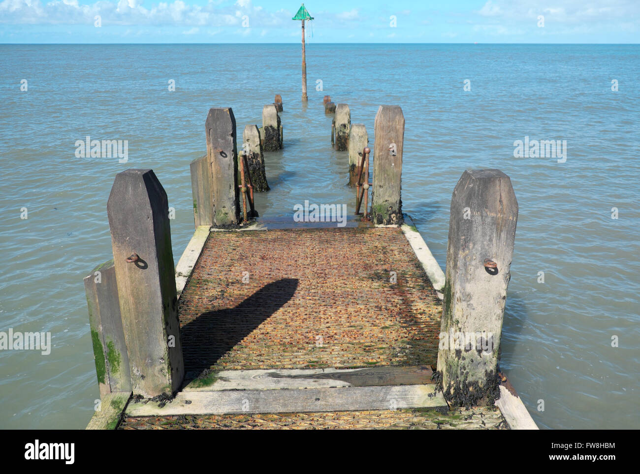 Seaside pier jetty disappearing into the sea Stock Photo - Alamy