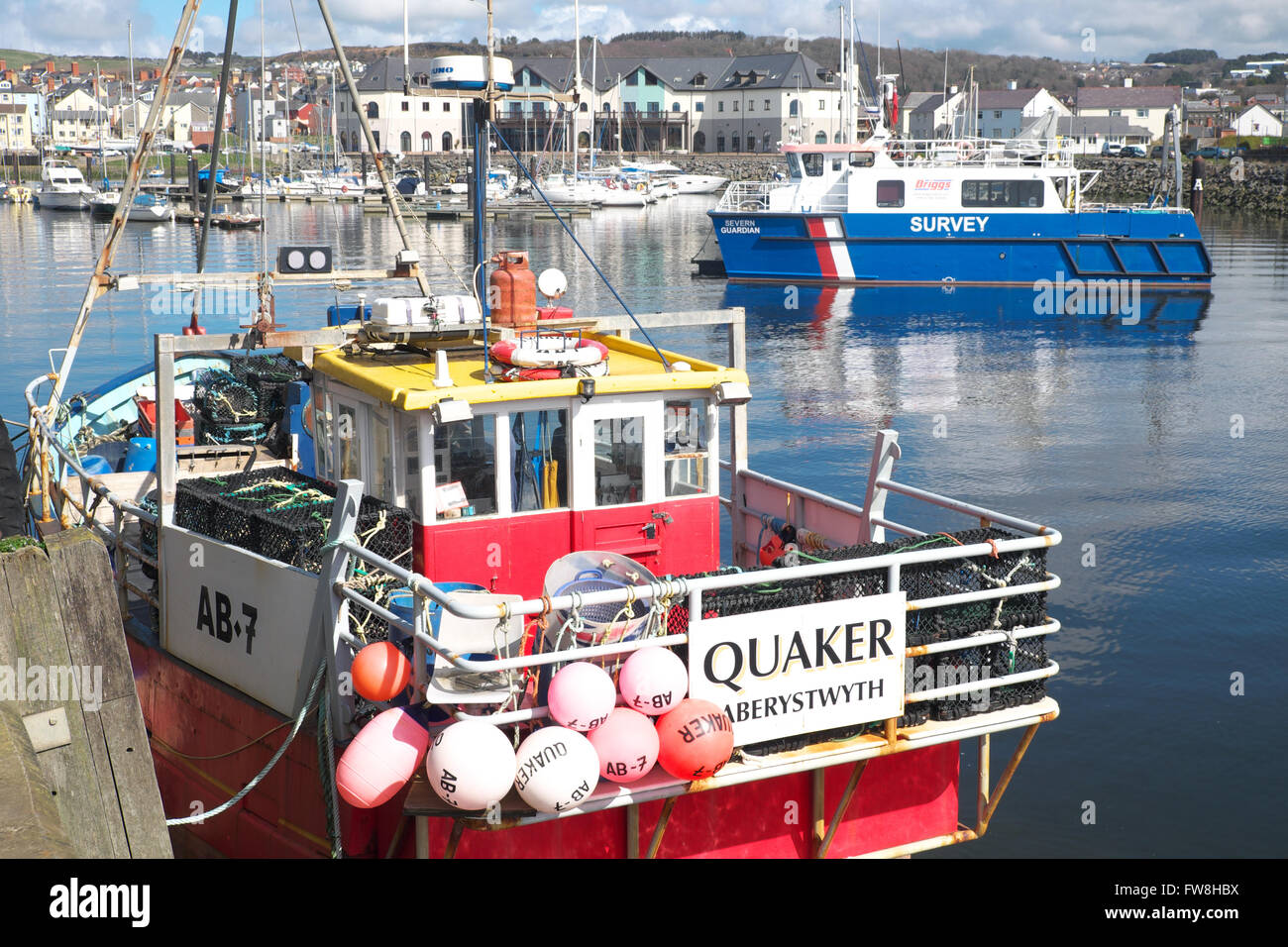 Aberystwyth Wales the fishing harbour with a local fishing boat and a ...