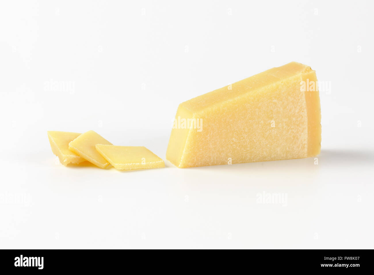 sliced parmesan cheese on white background Stock Photo - Alamy