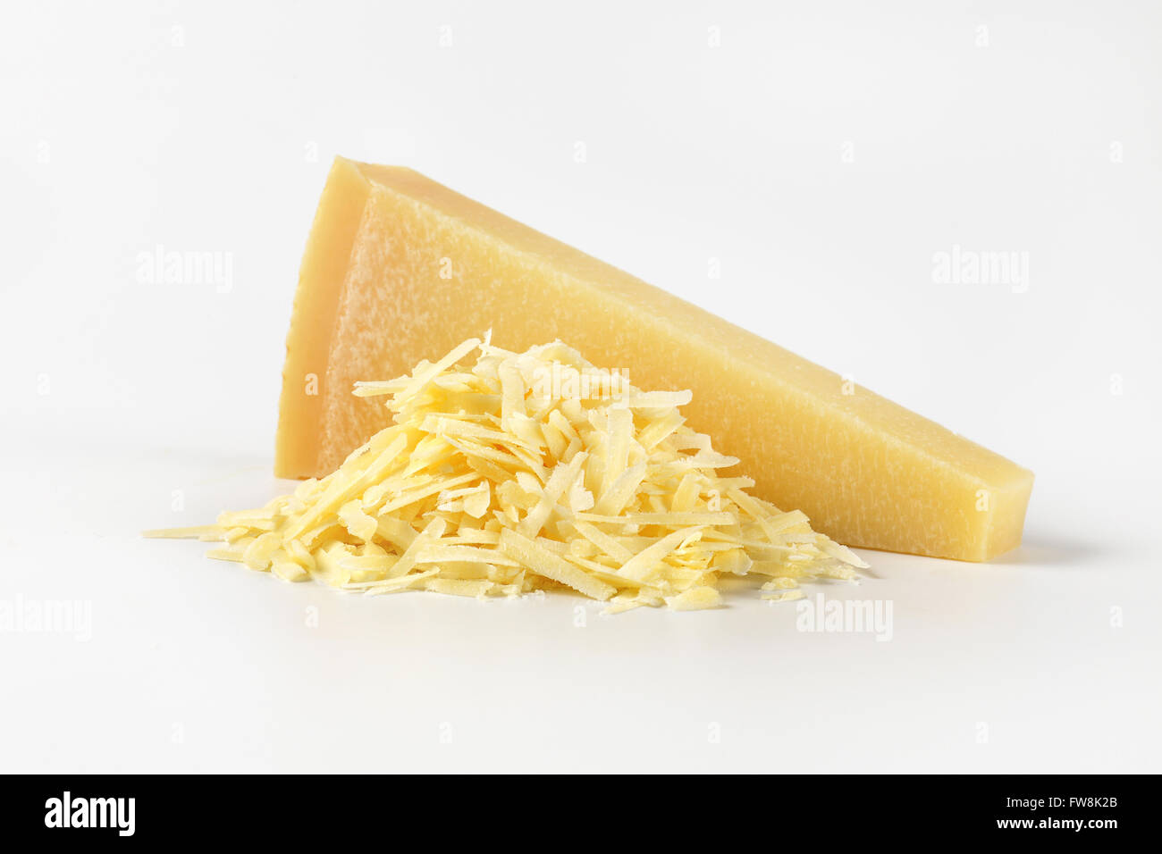 whole and grated parmesan cheese on white background Stock Photo - Alamy