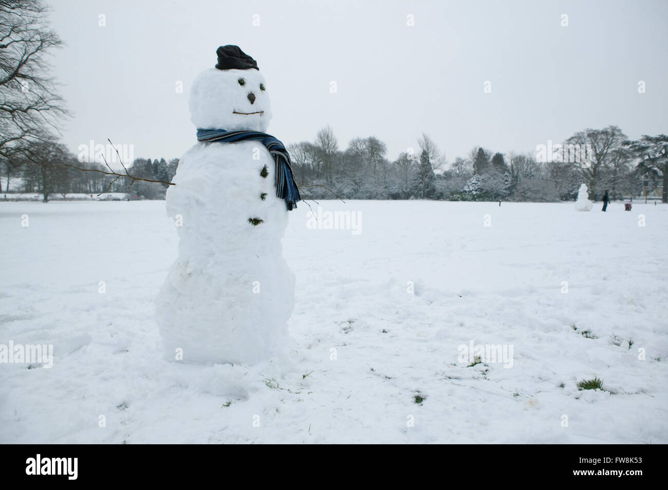 A snowman made in the freshly fallen snow of a British winter standing ...