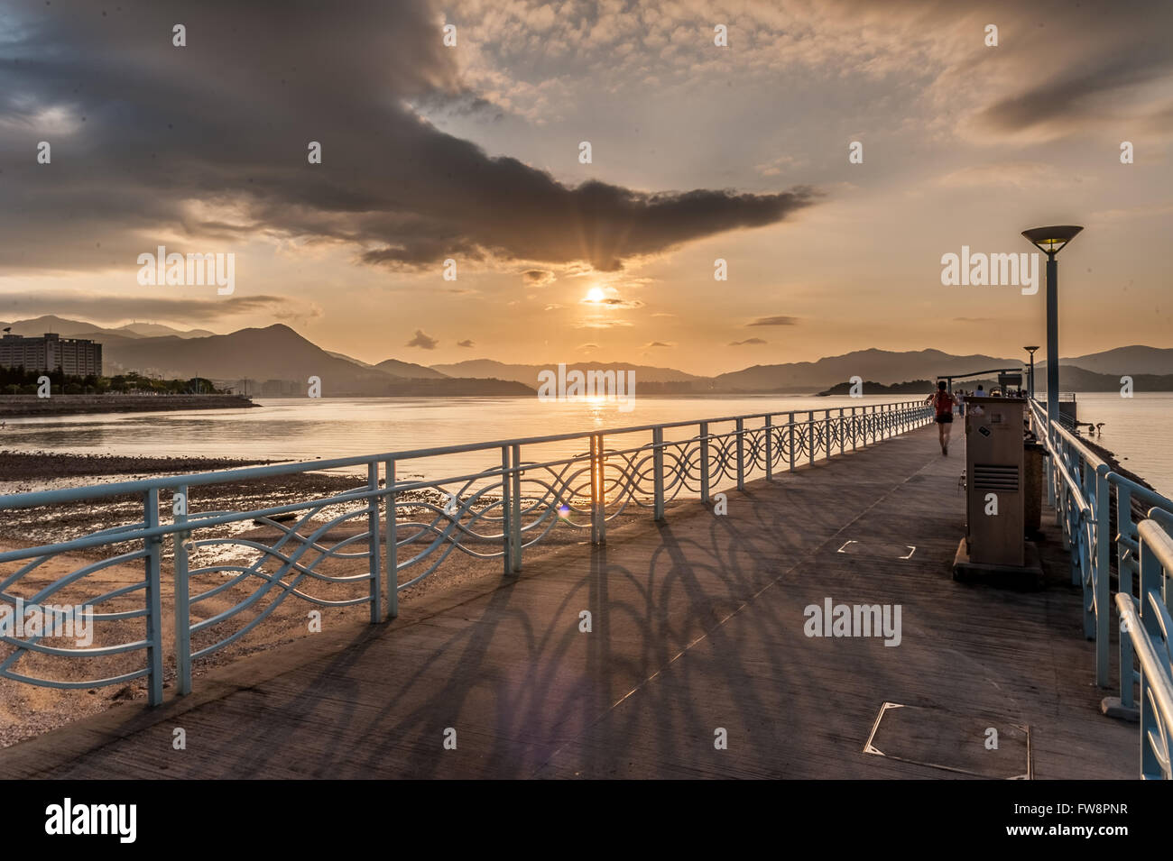 Sunset on top of a dock Stock Photo - Alamy