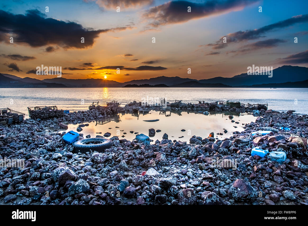 Beautiful sunset rocky beach on hi-res stock photography and images - Alamy