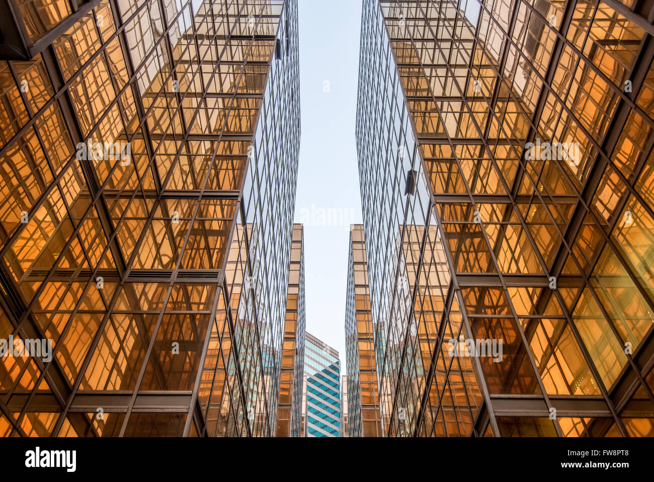 Golden office building in Hong Kong, looking up in between Stock Photo ...