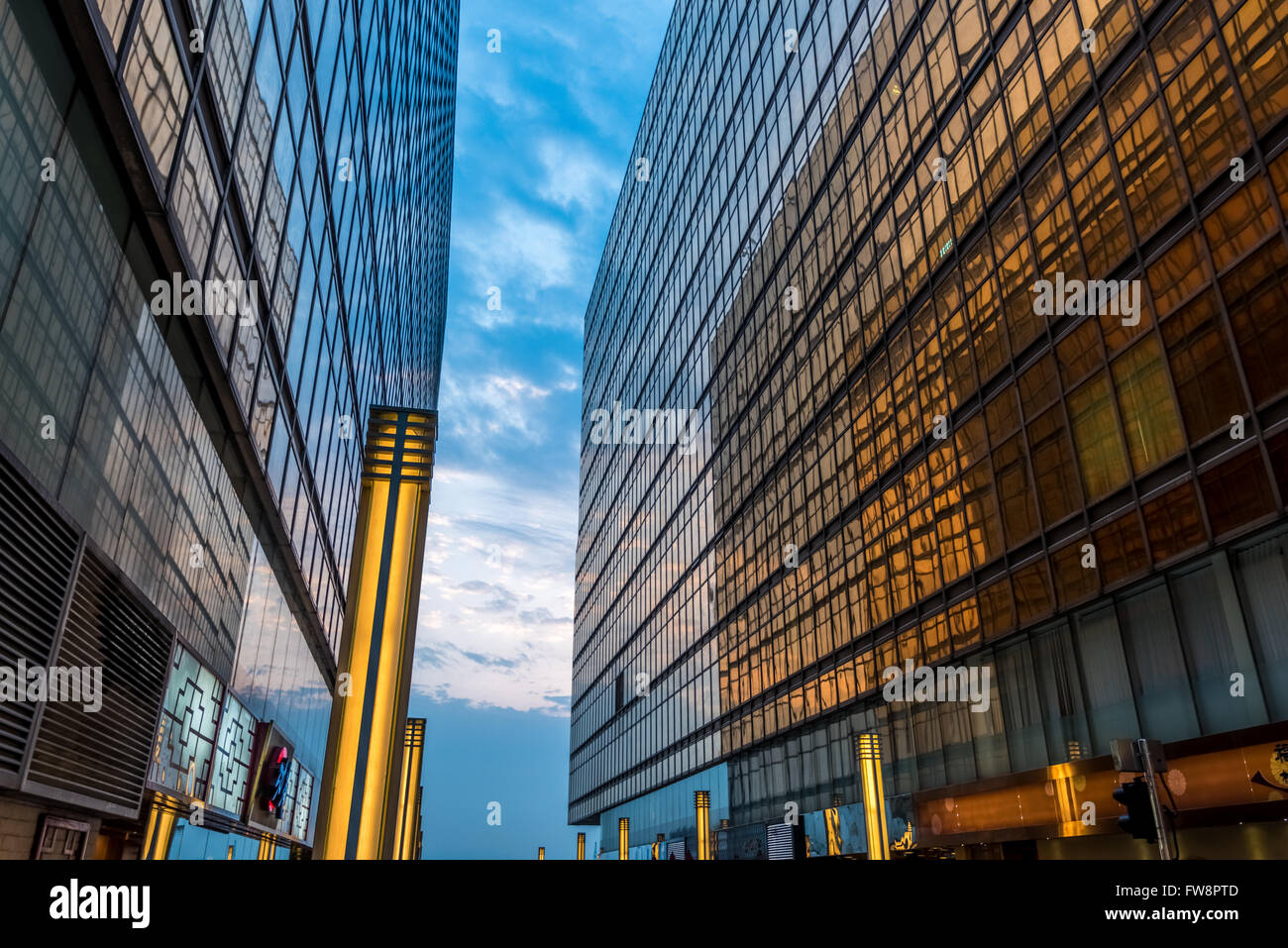 Golden office building in Hong Kong, looking up in between Stock Photo ...