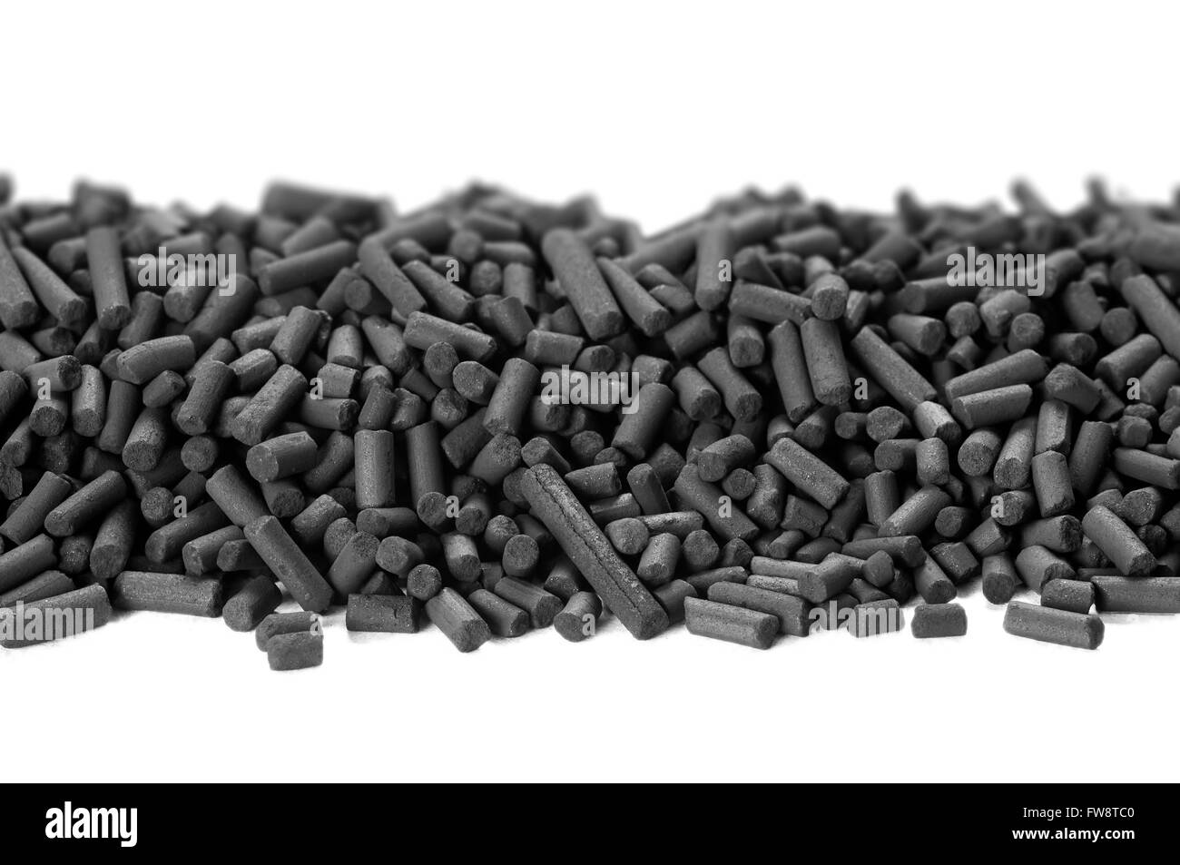 Activated carbon granules on white background Stock Photo - Alamy