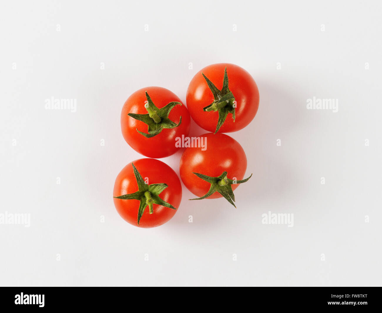 Four fresh red cherry tomatoes Stock Photo - Alamy