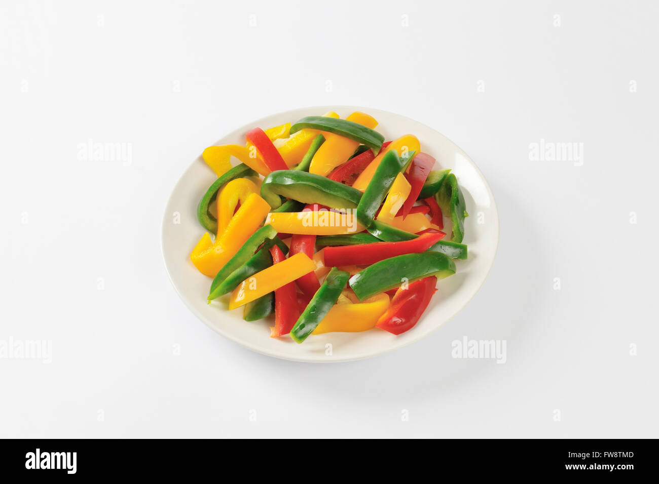 Plate of three color bell pepper strips Stock Photo - Alamy