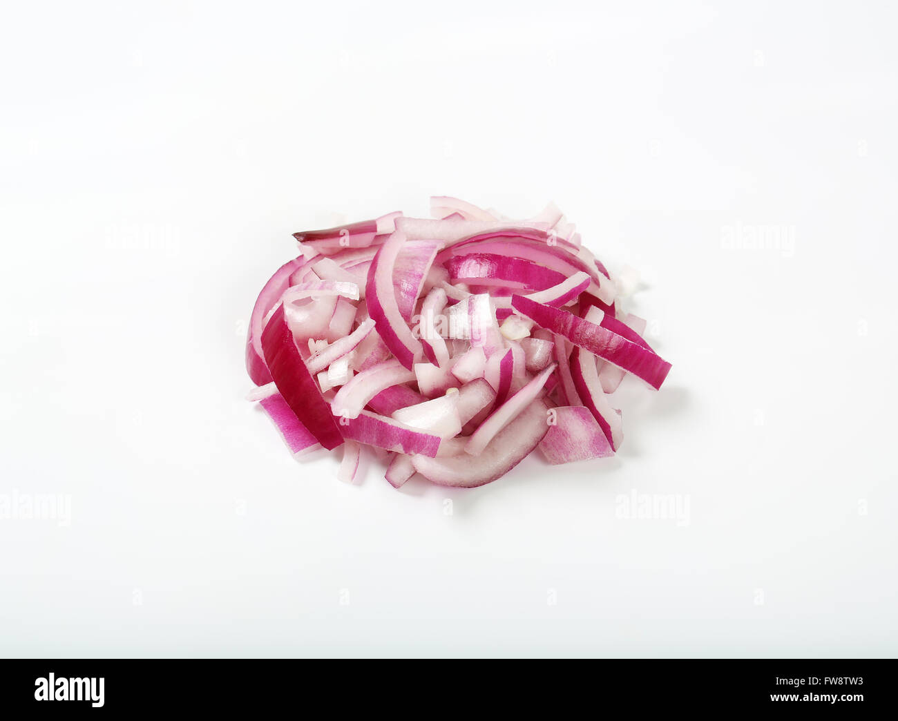 heap of chopped red onion on white background Stock Photo - Alamy