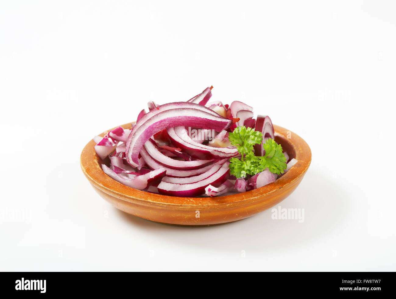 bowl of chopped red onion on white background Stock Photo - Alamy