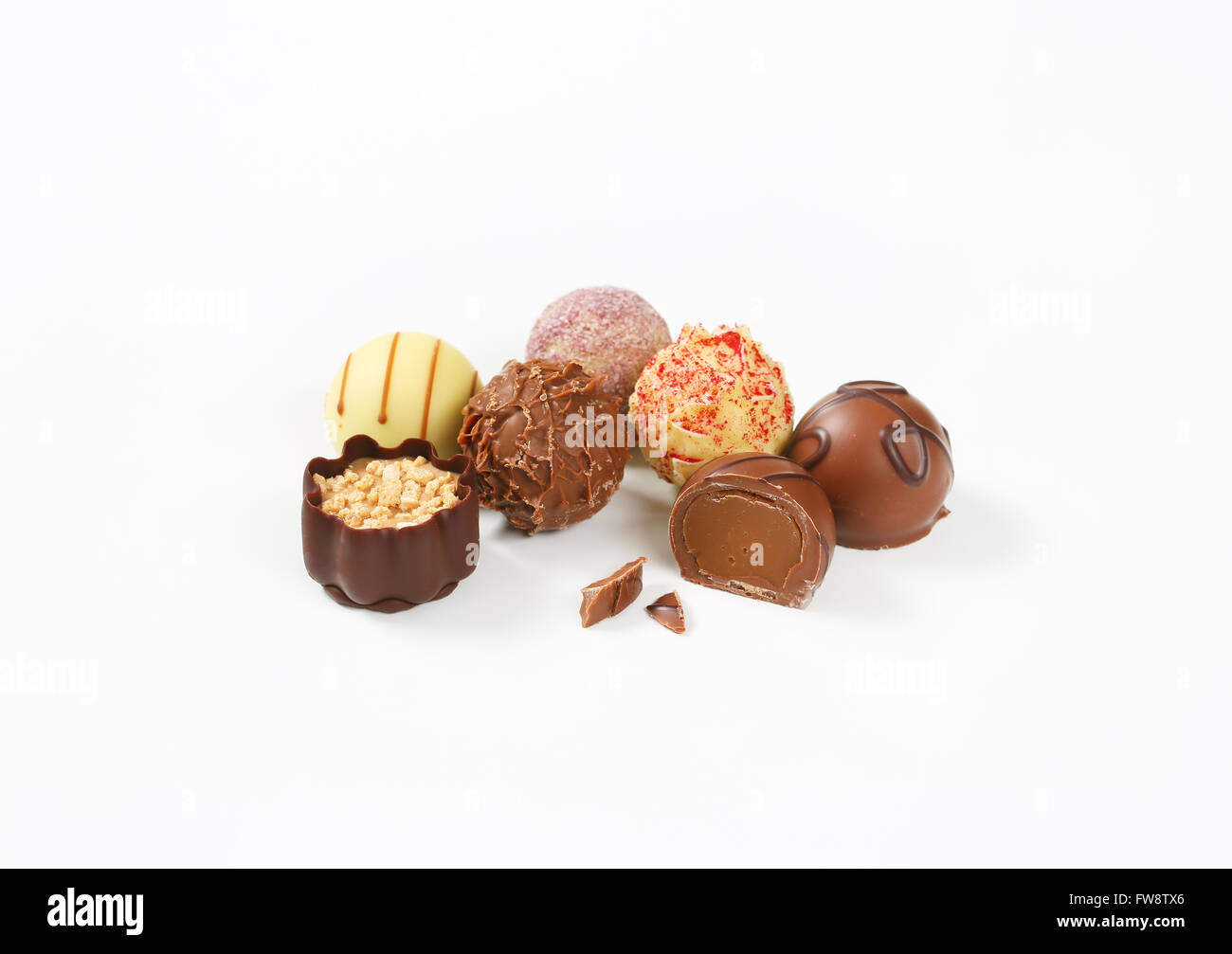 assorted belgian chocolate pralines on white background Stock Photo - Alamy