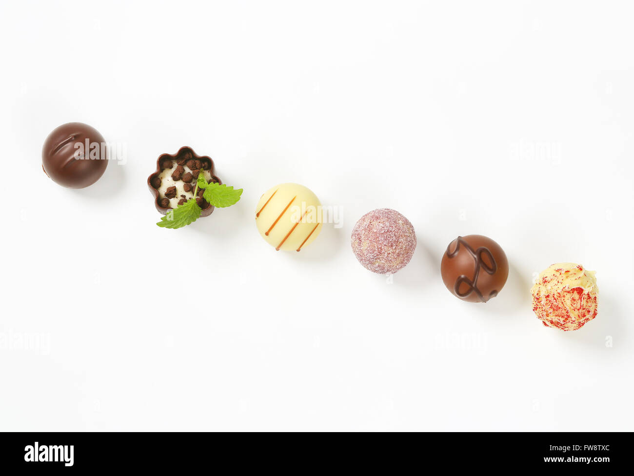line of assorted belgian chocolate pralines on white background Stock ...