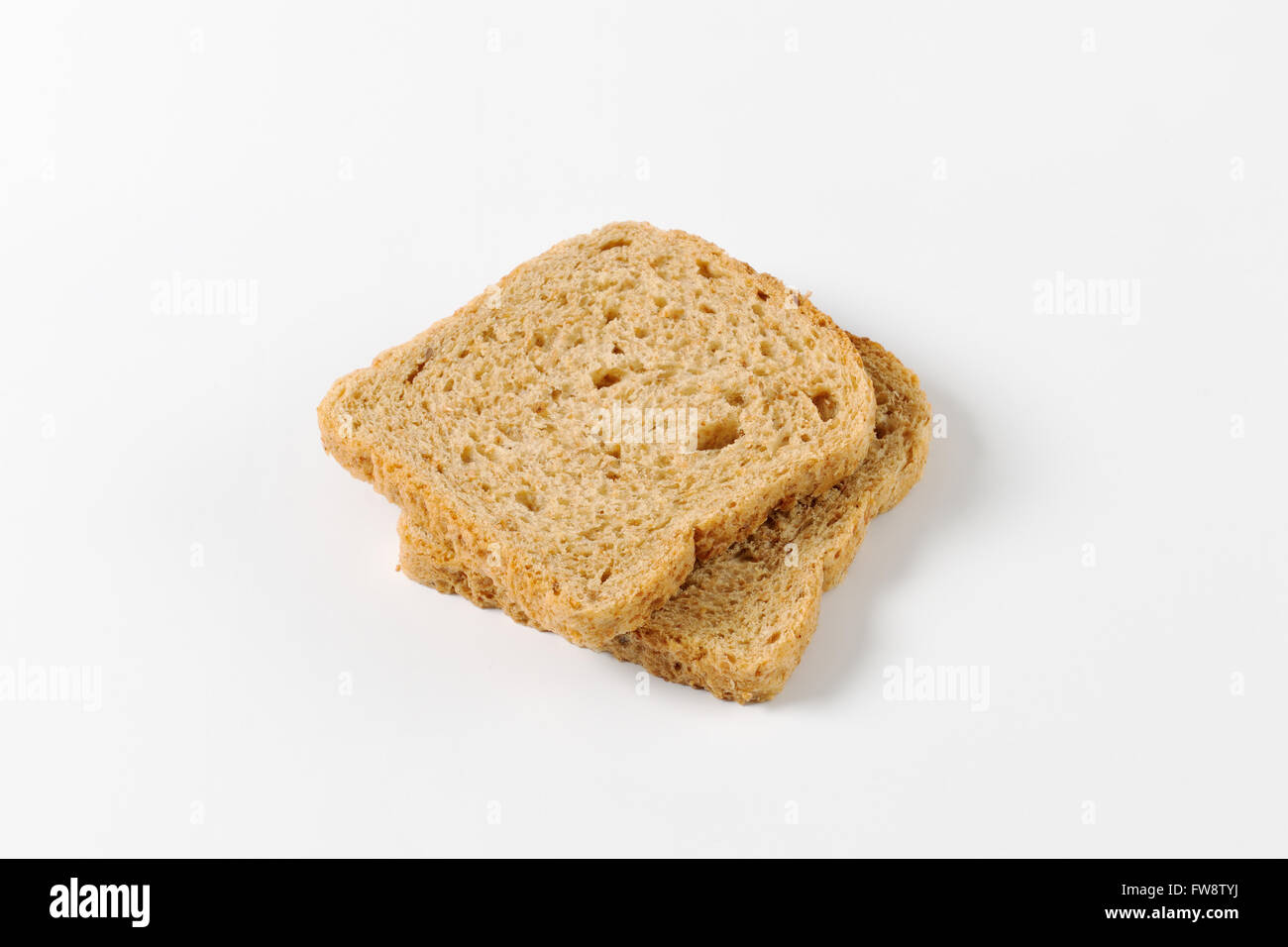 two slices of whole grain bread Stock Photo - Alamy
