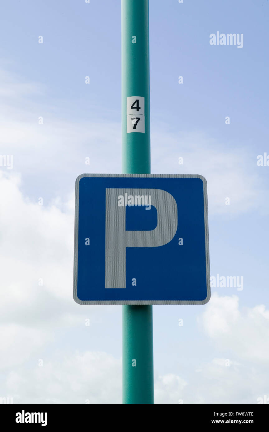 A large capital "P" on a sign attached to a lamp post in the UK ...