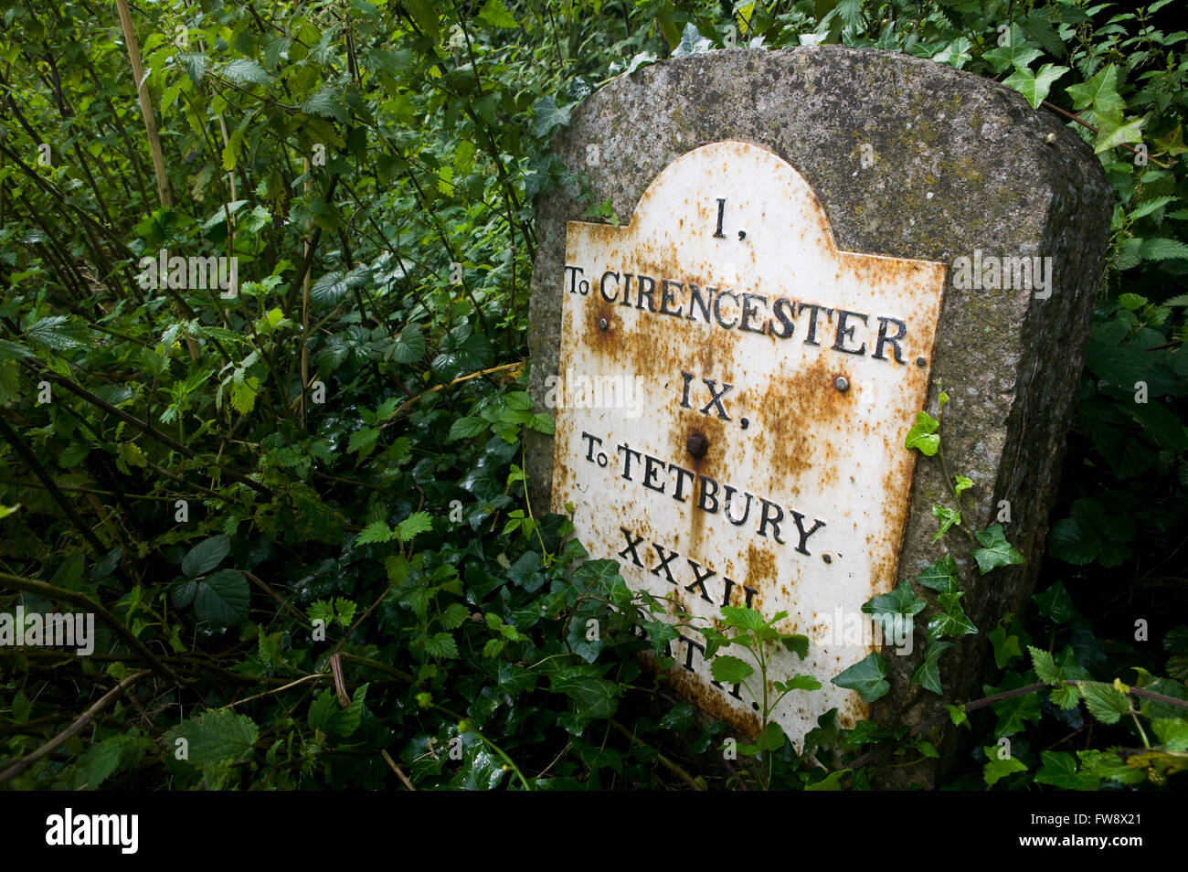 An old mile marker or stone used on road sides to indicate distances to ...