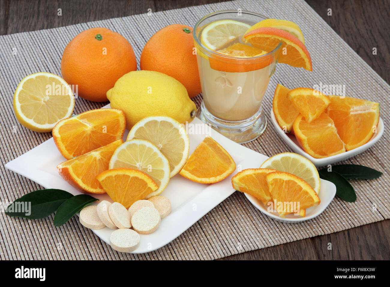 Cold and flu health remedy drink with orange and lemon fruit and ...