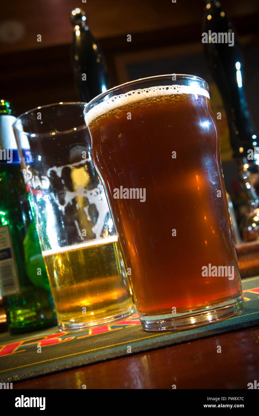 A pint of bitter standing on the bar of a pub, a typical scene in the ...