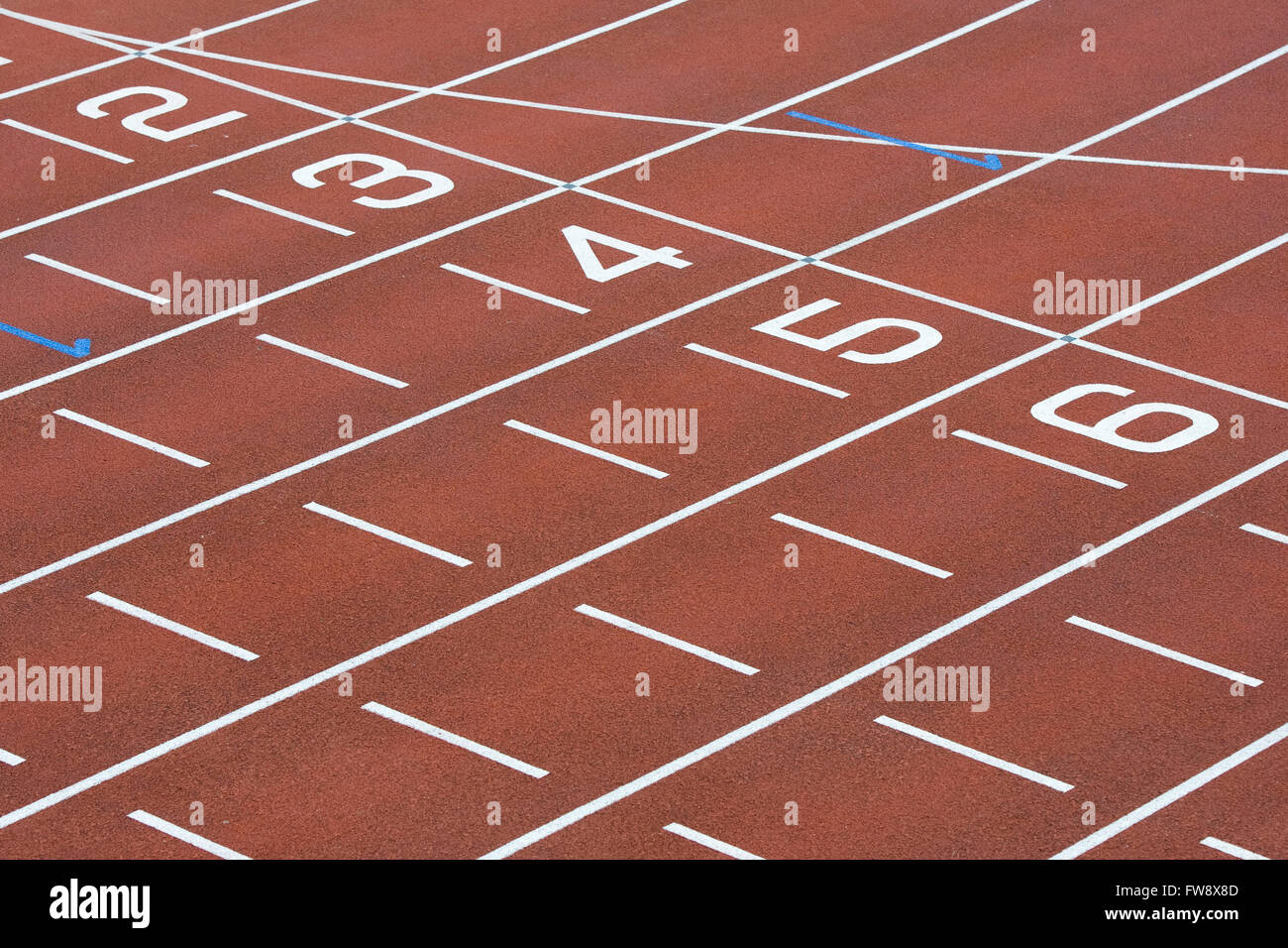 starting blocks and numbered lanes on a sports runing track Stock Photo ...