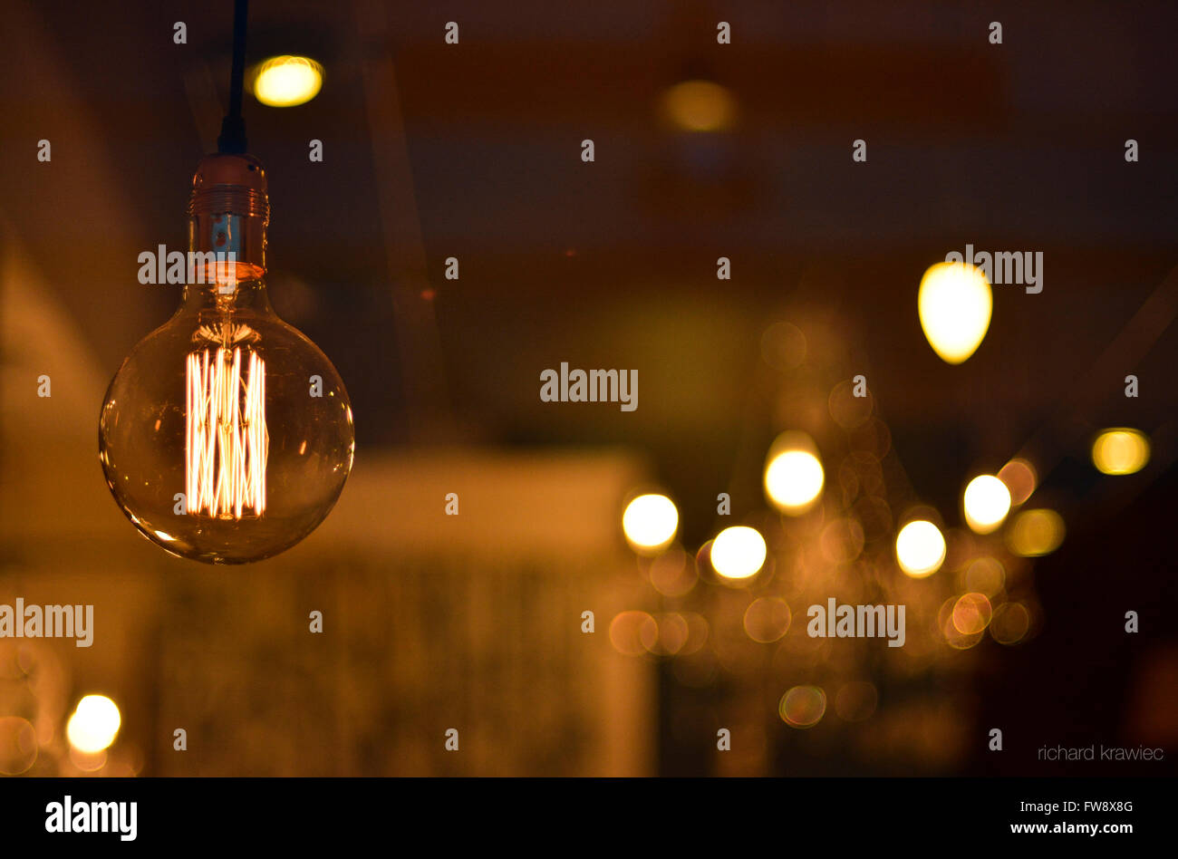 Electric light Bulb - old style with filament Stock Photo - Alamy