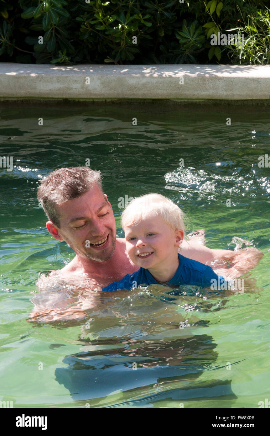 Teaching his son to swim hi-res stock photography and images - Alamy