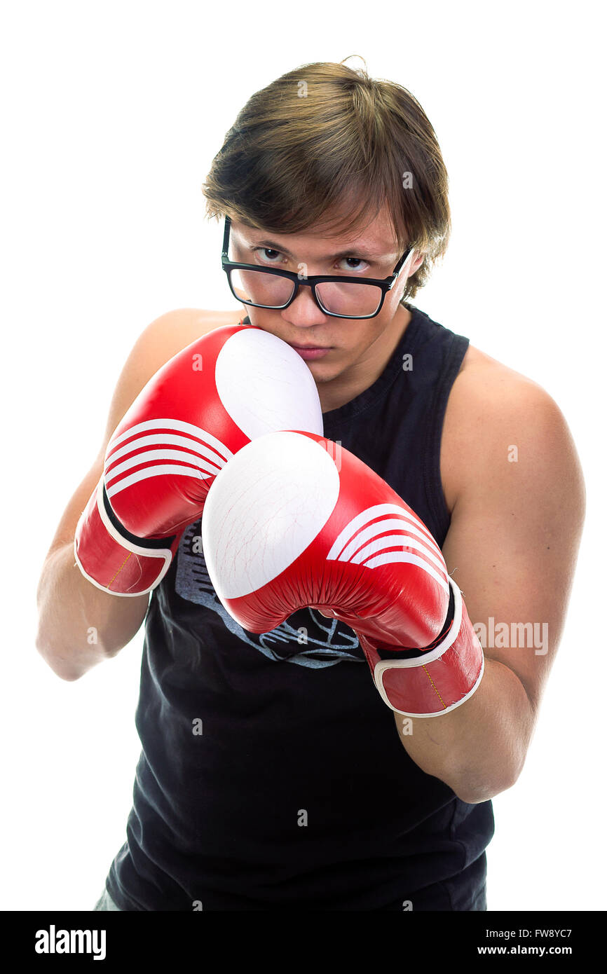 studio portrait of a guy with glasses and boxing gloves isolated on ...