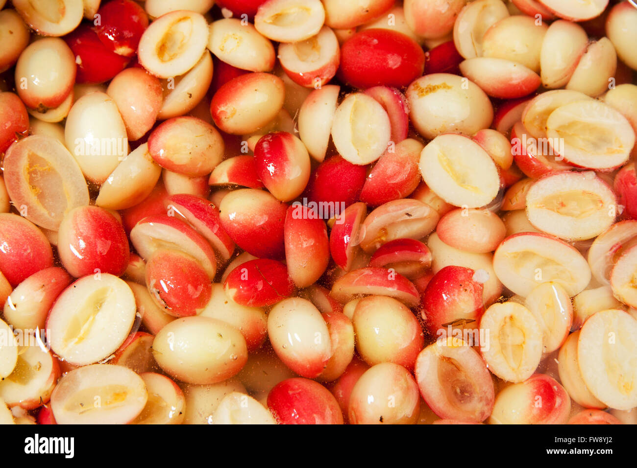 Carunda herbal fruit cut hemispherical fermented in brine Stock Photo ...