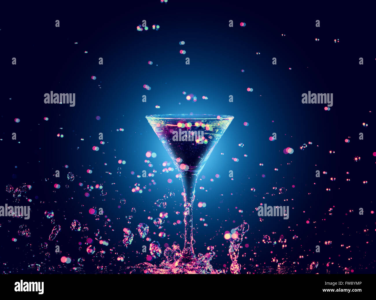 Colourful cocktail in glass with splash Stock Photo - Alamy