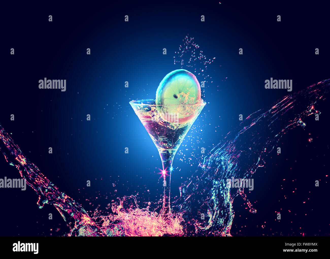 Colourful cocktail in glass with splash Stock Photo - Alamy