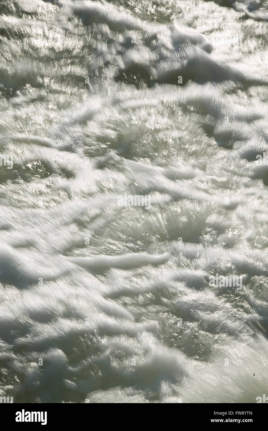 Water churning and bubbling with energy as it falls from a lock and ...