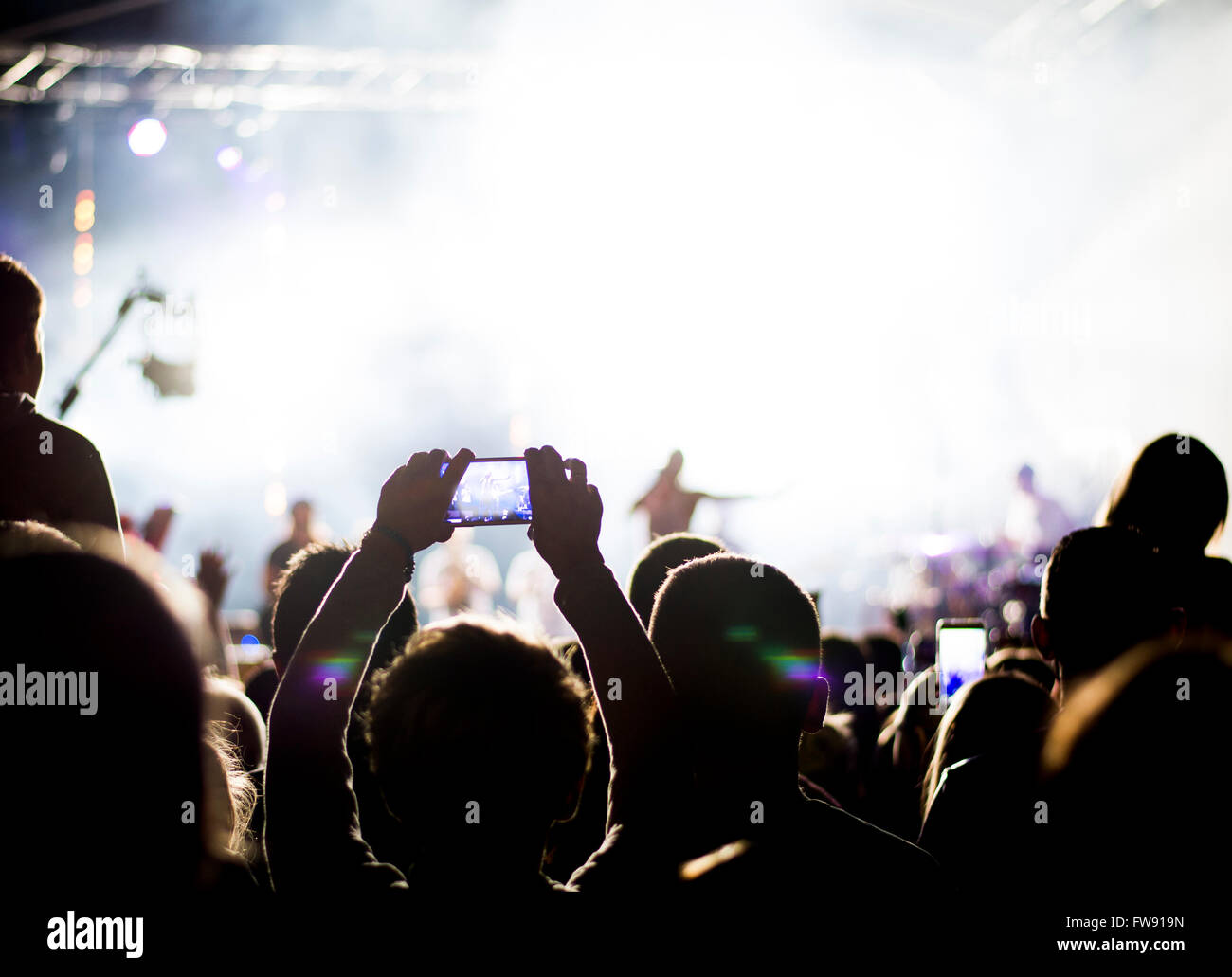 recording concert crowd in front of bright stage lights, noise Stock ...