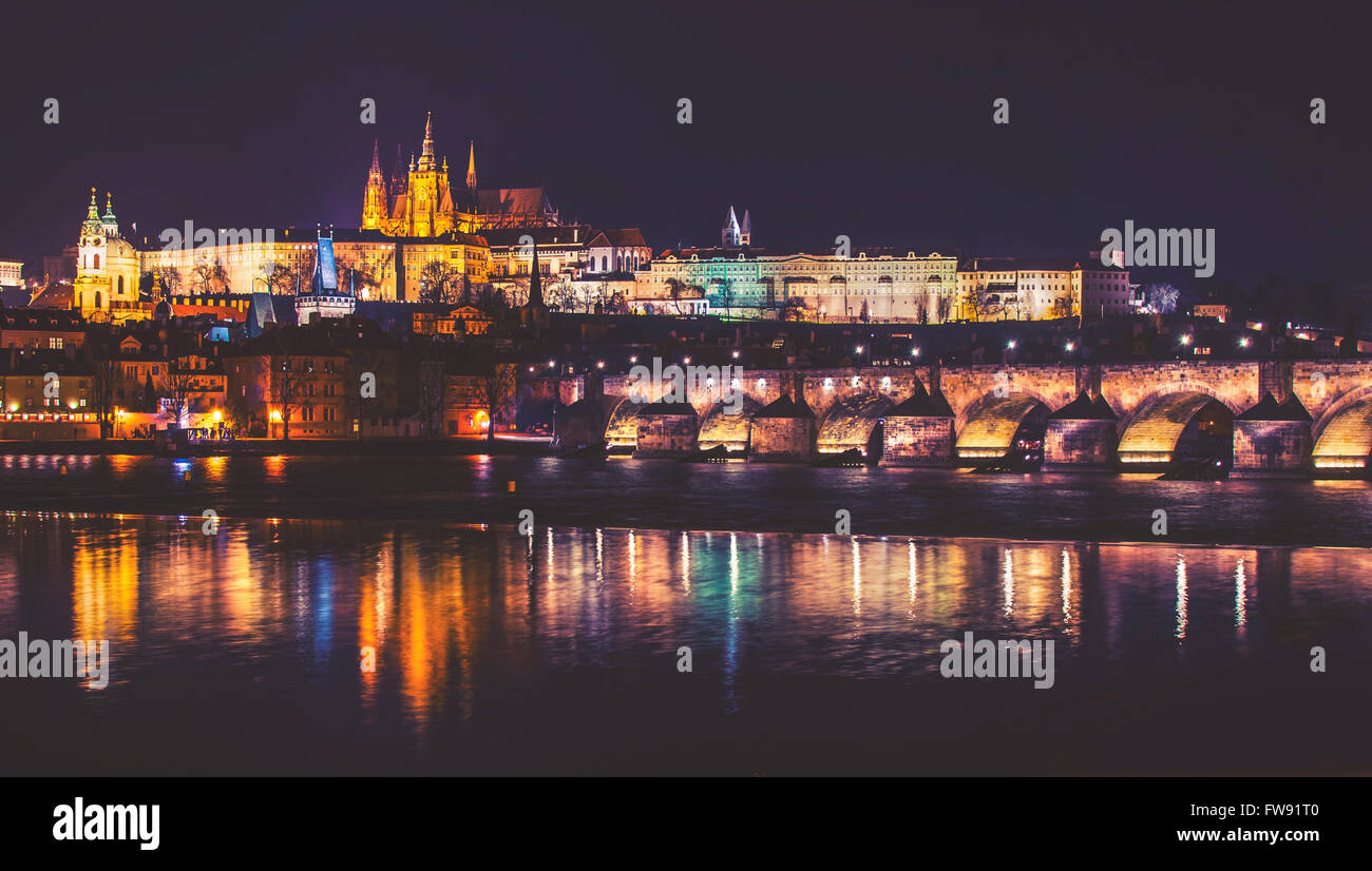 Castle, Charles Bridge and Vltava river, Night panorama of Prague, Czech Republic, vintage ...
