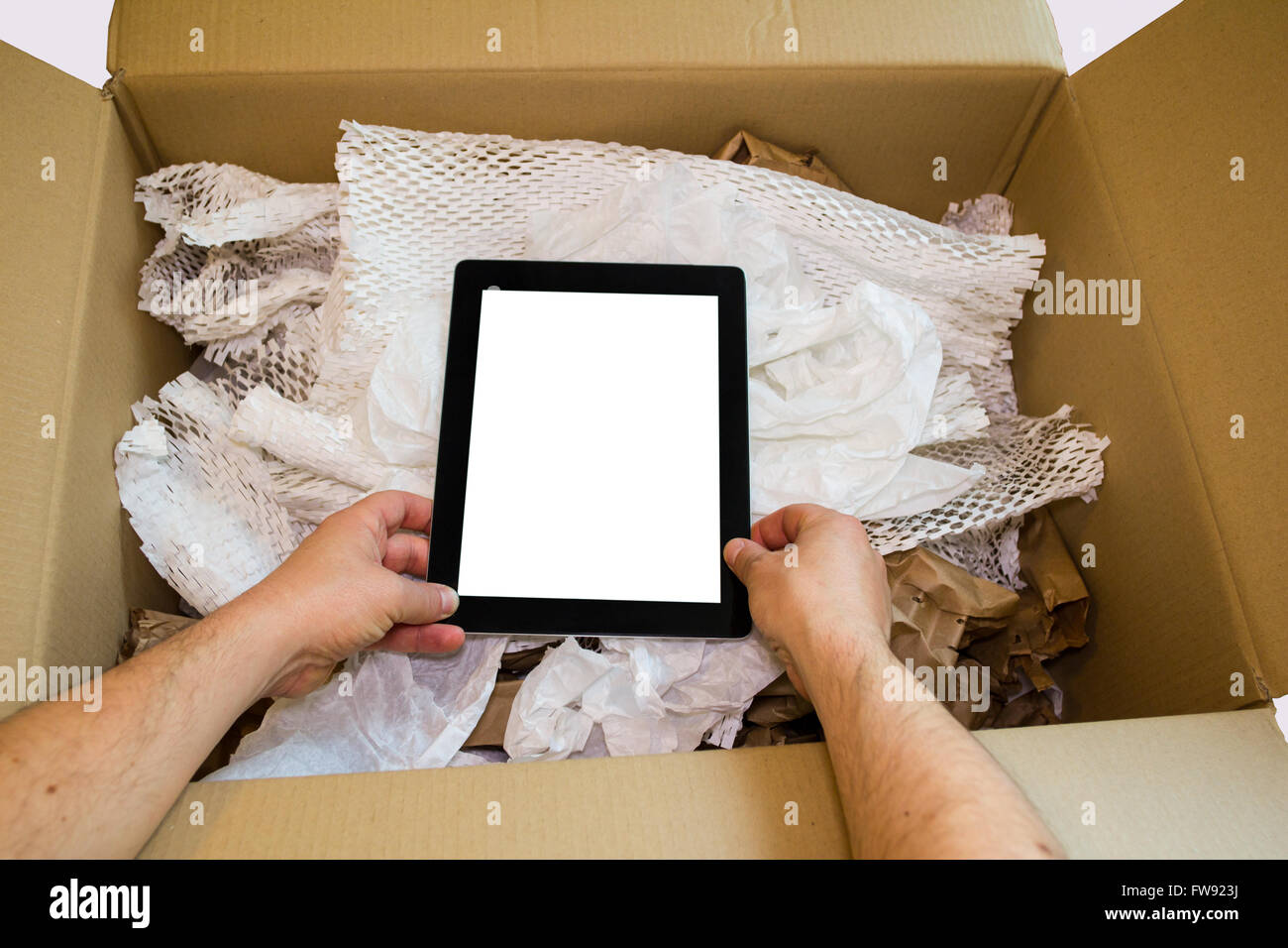 User hands unboxing new tablet computer Stock Photo - Alamy