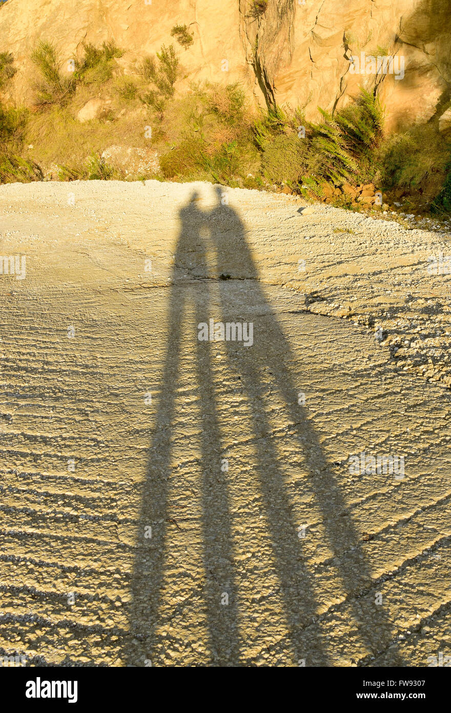 Shadows of a couple at the sunset Stock Photo - Alamy