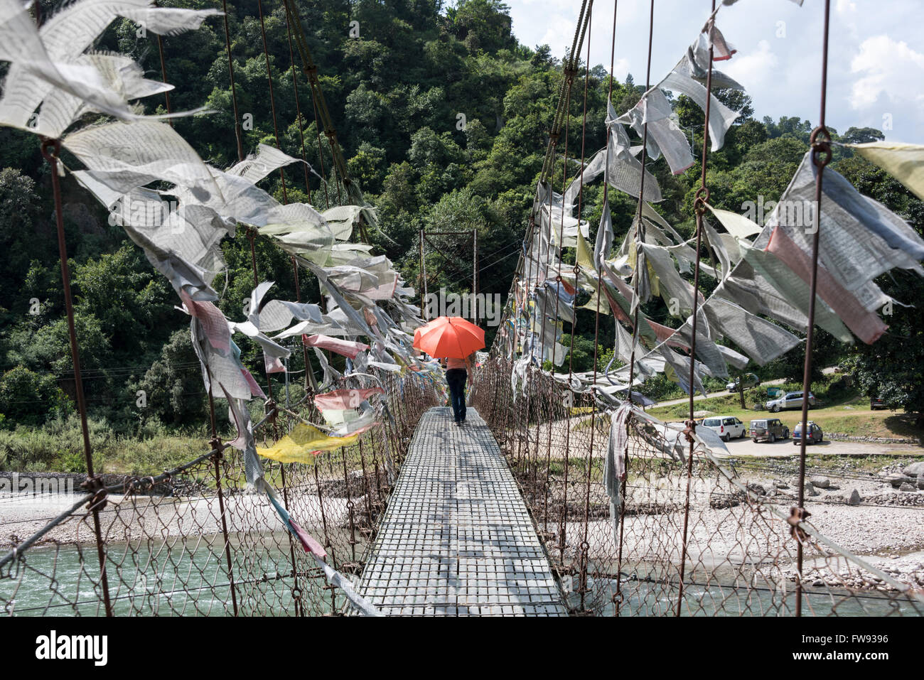 Prayer flags on bridge with people in background, Punakha, Bhutan Stock ...