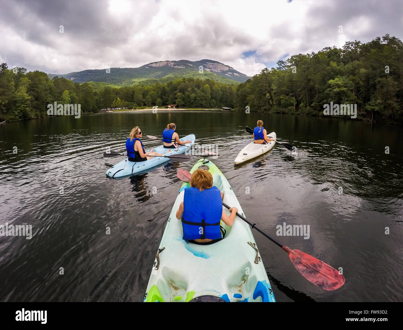 Family enjoys kayaking on Pinnacle Lake at Table Rock State Park in ...
