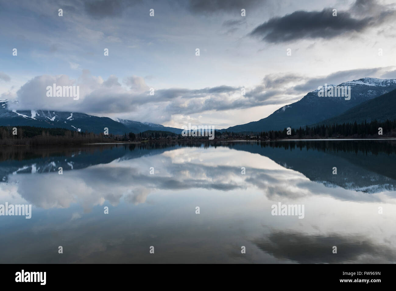 View of calm lake with mountains, Whistler, British Columbia, Canada ...