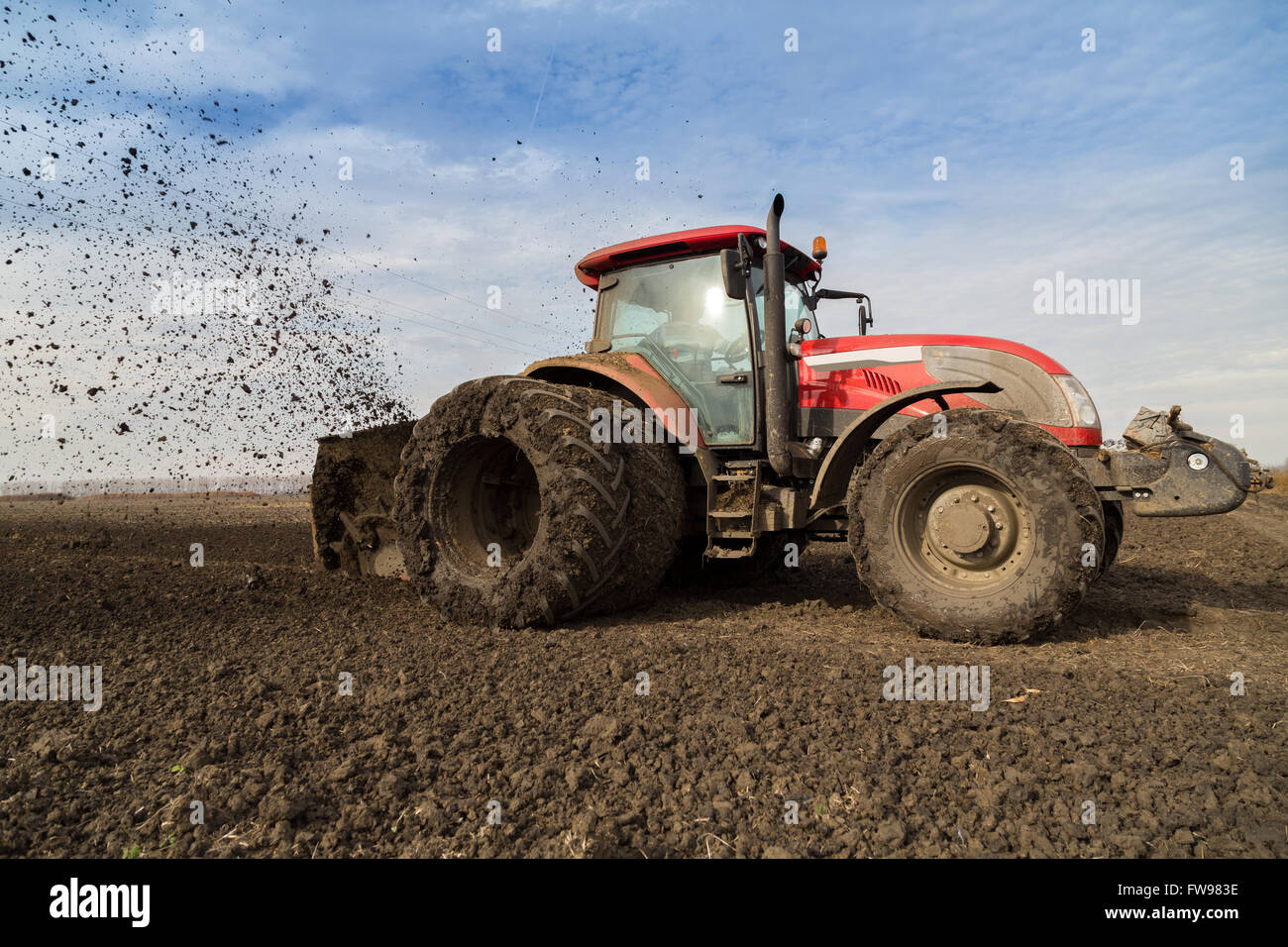 Tractor with double wheeled ditcher digging drainage canal Stock Photo ...