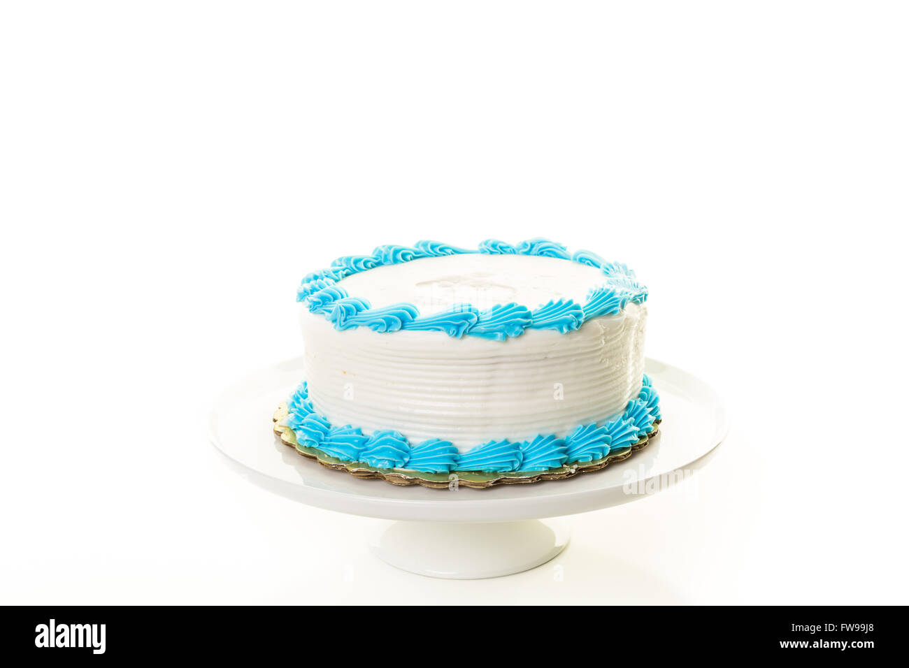 Simple white Birthday cake with white and blue icing Stock Photo - Alamy