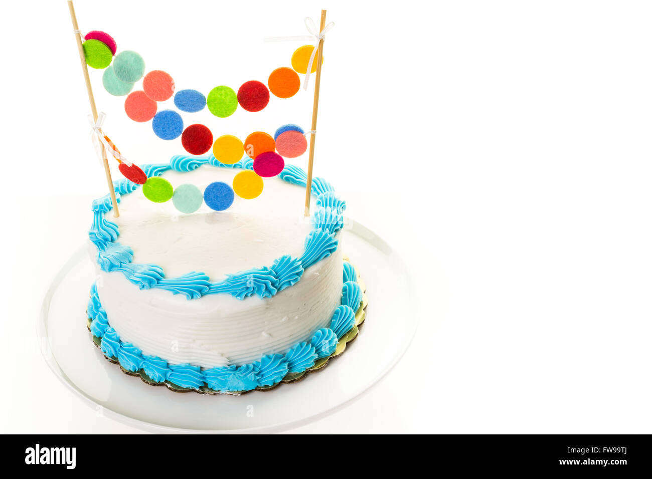 Simple white Birthday cake with cake garland Stock Photo - Alamy